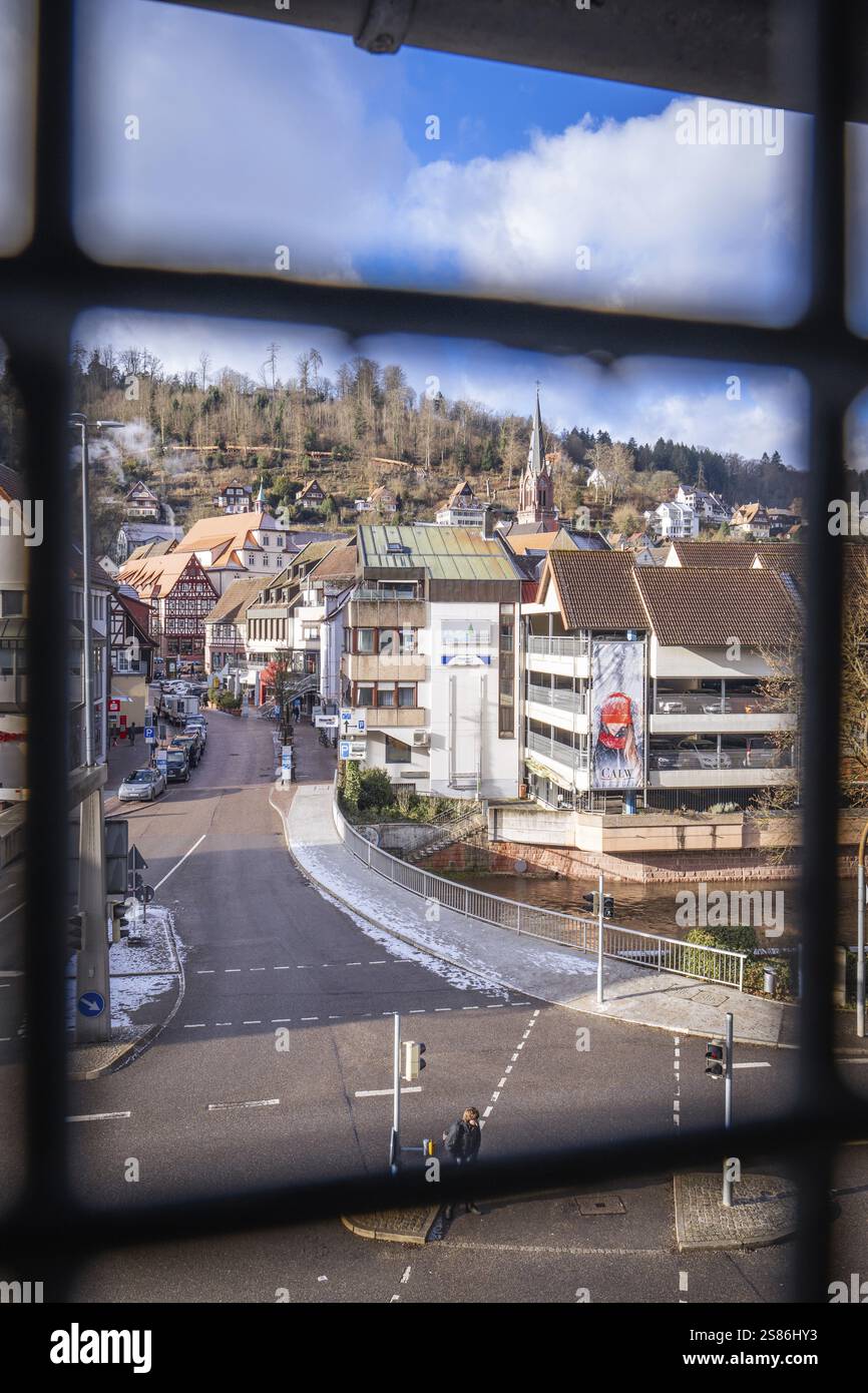 Town view visible through a grid with snow-covered streets and ...