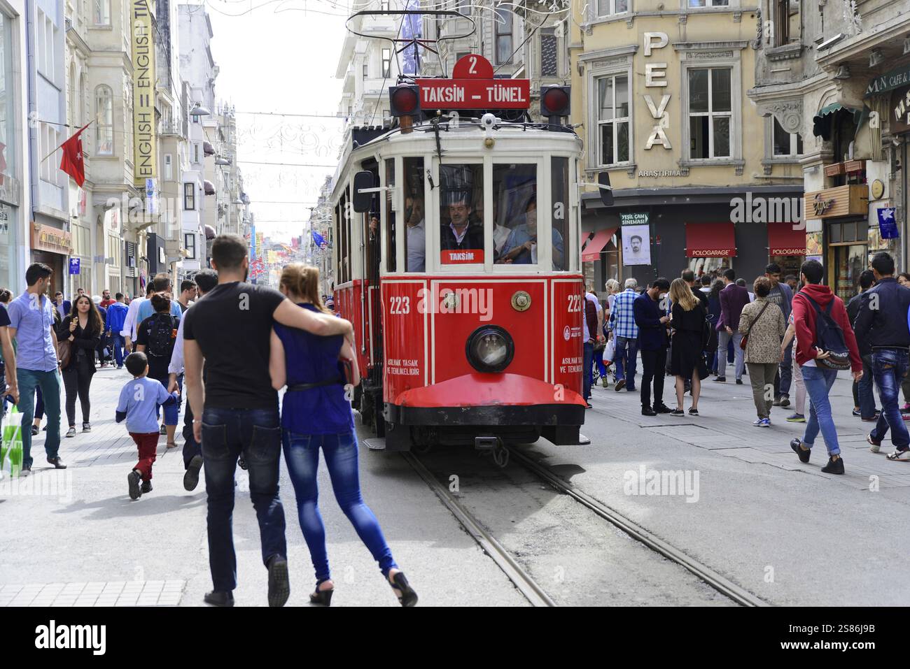 Historic tram Nostaljik Tramvay runs through shopping street Istiklal ...