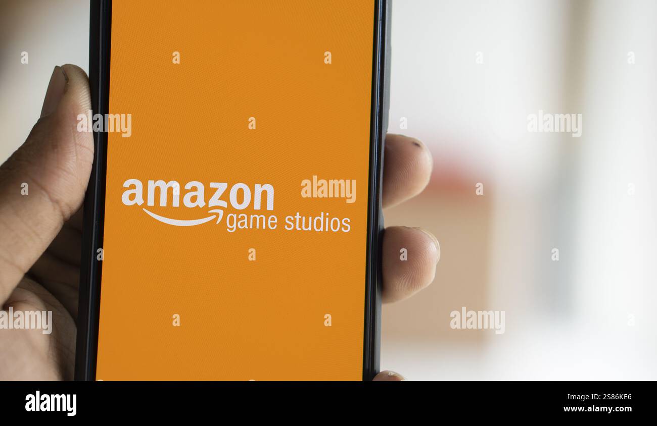 amazon game studios logo is displayed on smartphone. Amazon Games is an ...
