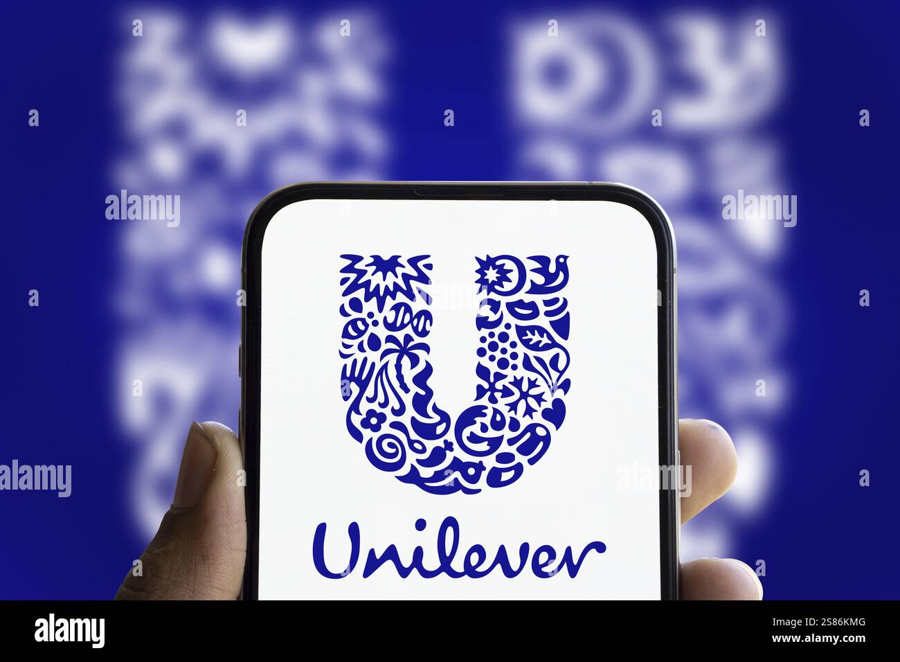 unilever logo is displayed on smartphone. Unilever PLC is a British ...