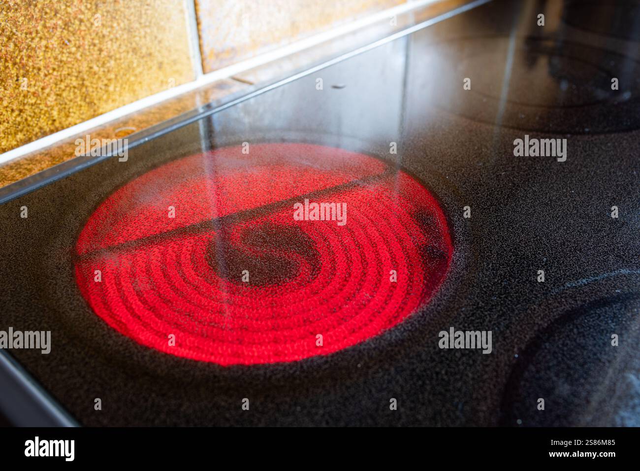 Electric induction stove red-hot glowing element, Close up shot, no ...