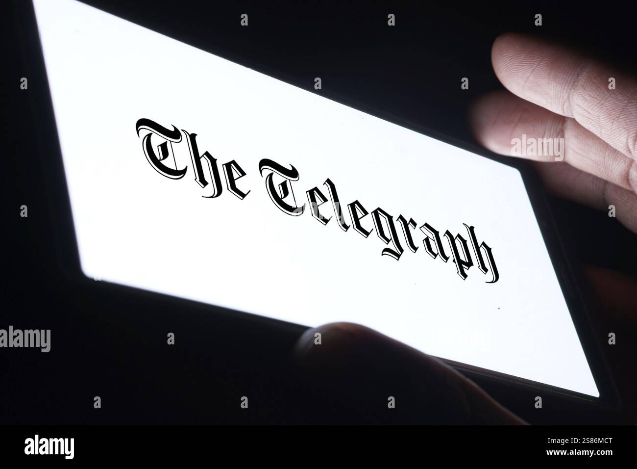 the telegraph logo is displayed on smartphone. The Telegraph is a ...