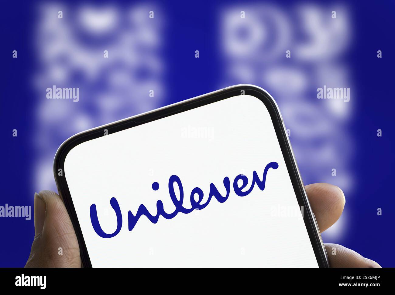 unilever logo is displayed on smartphone. Unilever PLC is a British ...