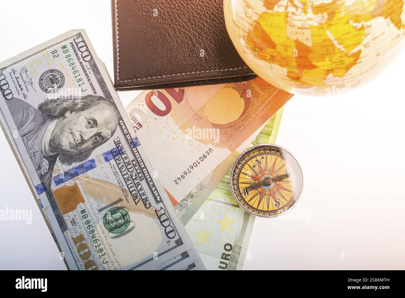 Hand is holding a magnetic compass on black background Stock Photo - Alamy