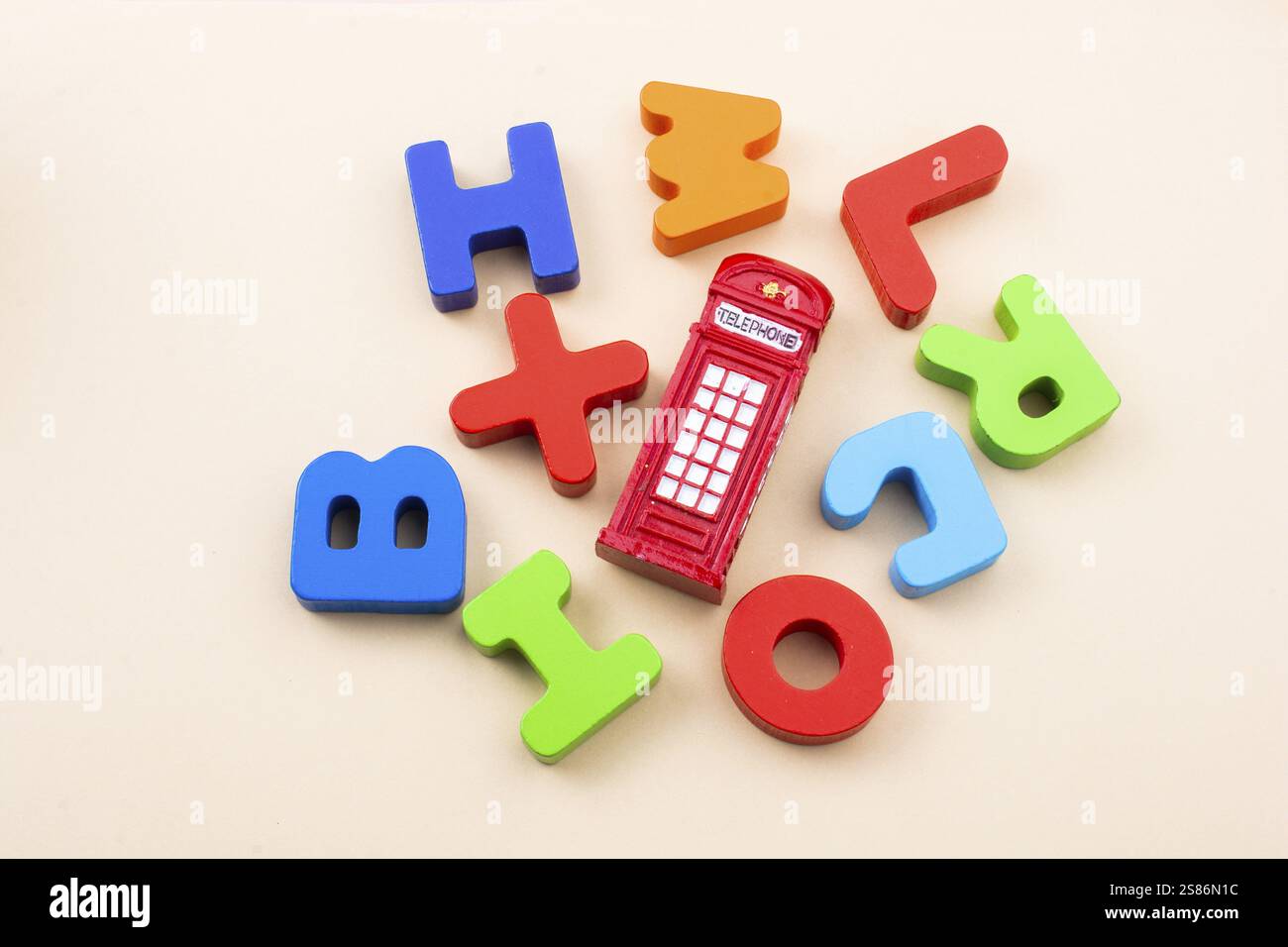 Colorful wooden ABC alphabet letter blocks and British telephone boot ...