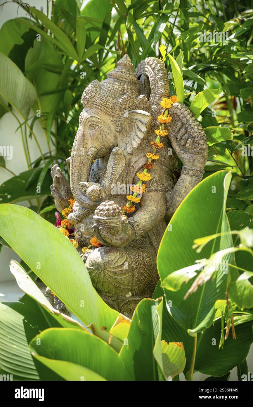 Garland of golden flowers draped around Ganesha, the Hindu god of ...