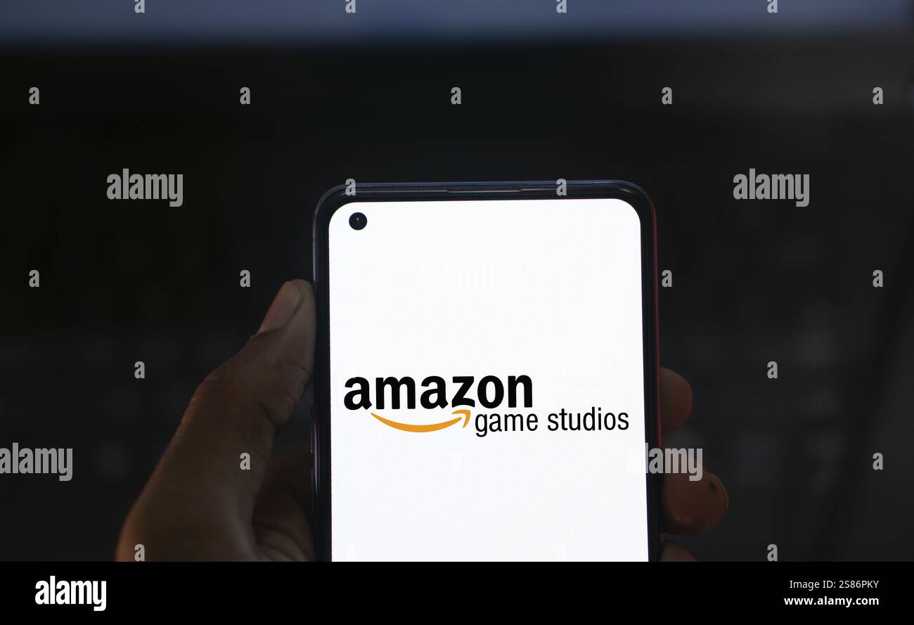 amazon game studios logo is displayed on smartphone. Amazon Games is an ...