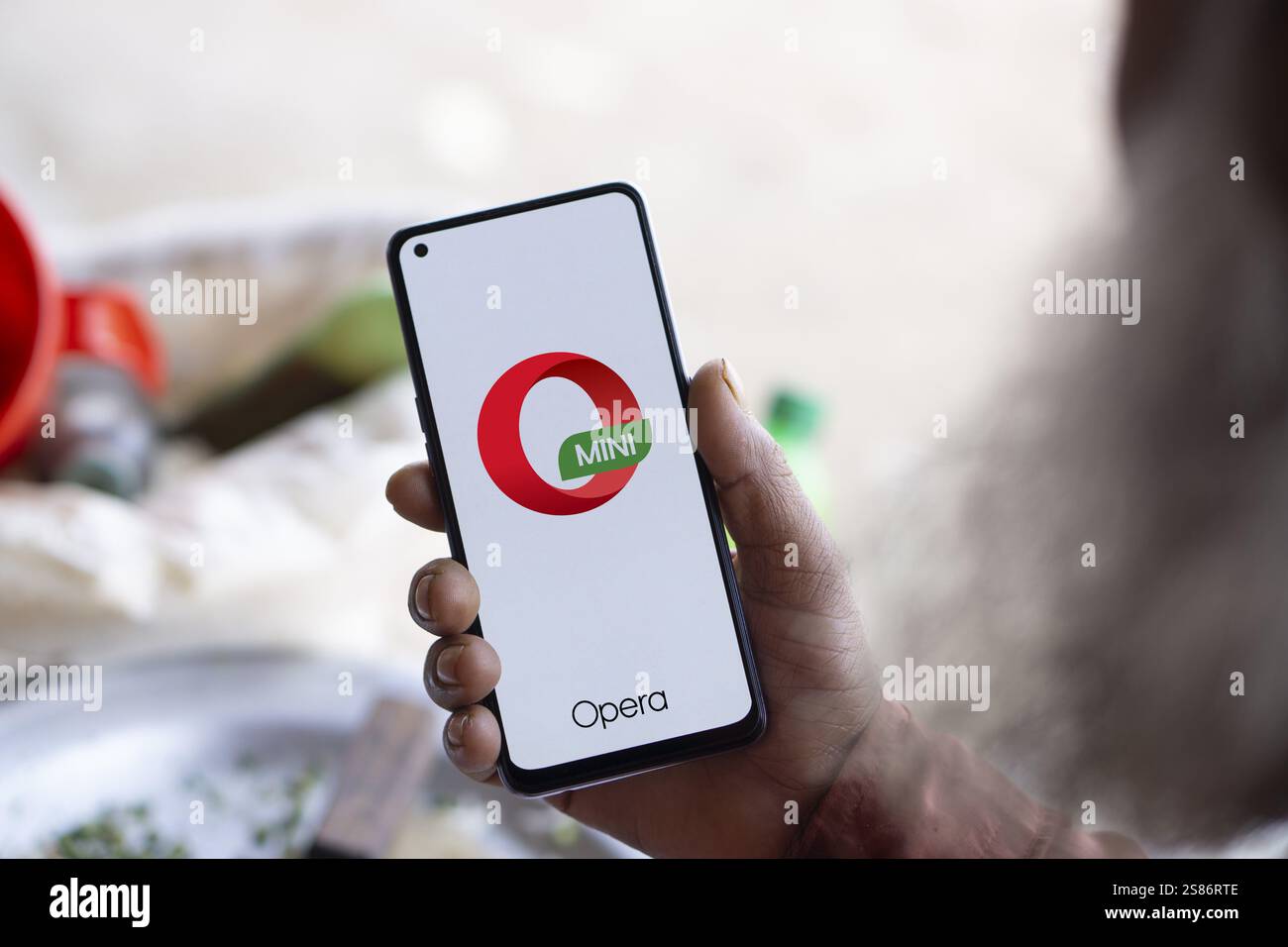 Opera mini logo is displayed on smartphone. Opera Mini is a mobile web browser made by Opera ...