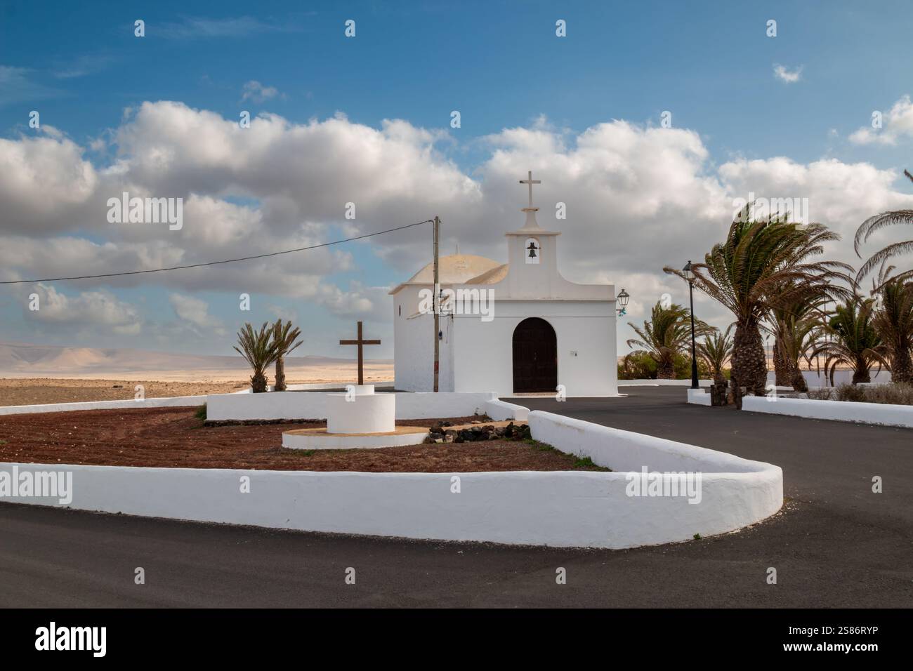 Traditional white facade of the architecture. Small church with a ...