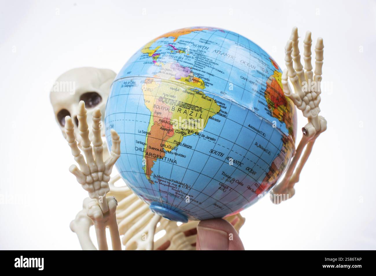 The earth in a skeleton hand Stock Photo - Alamy