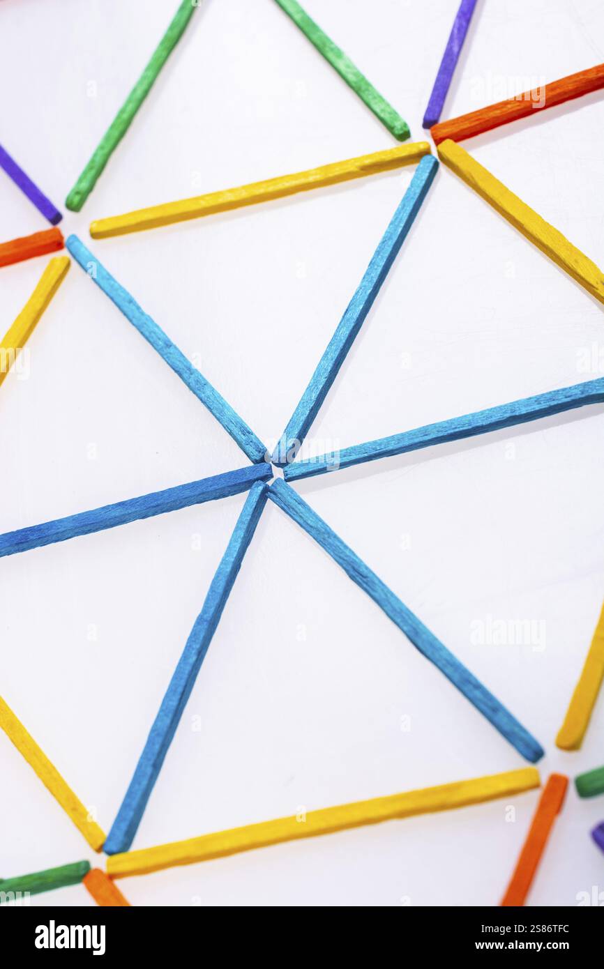 Geometric figures triangles formed with colorful sticks Stock Photo - Alamy