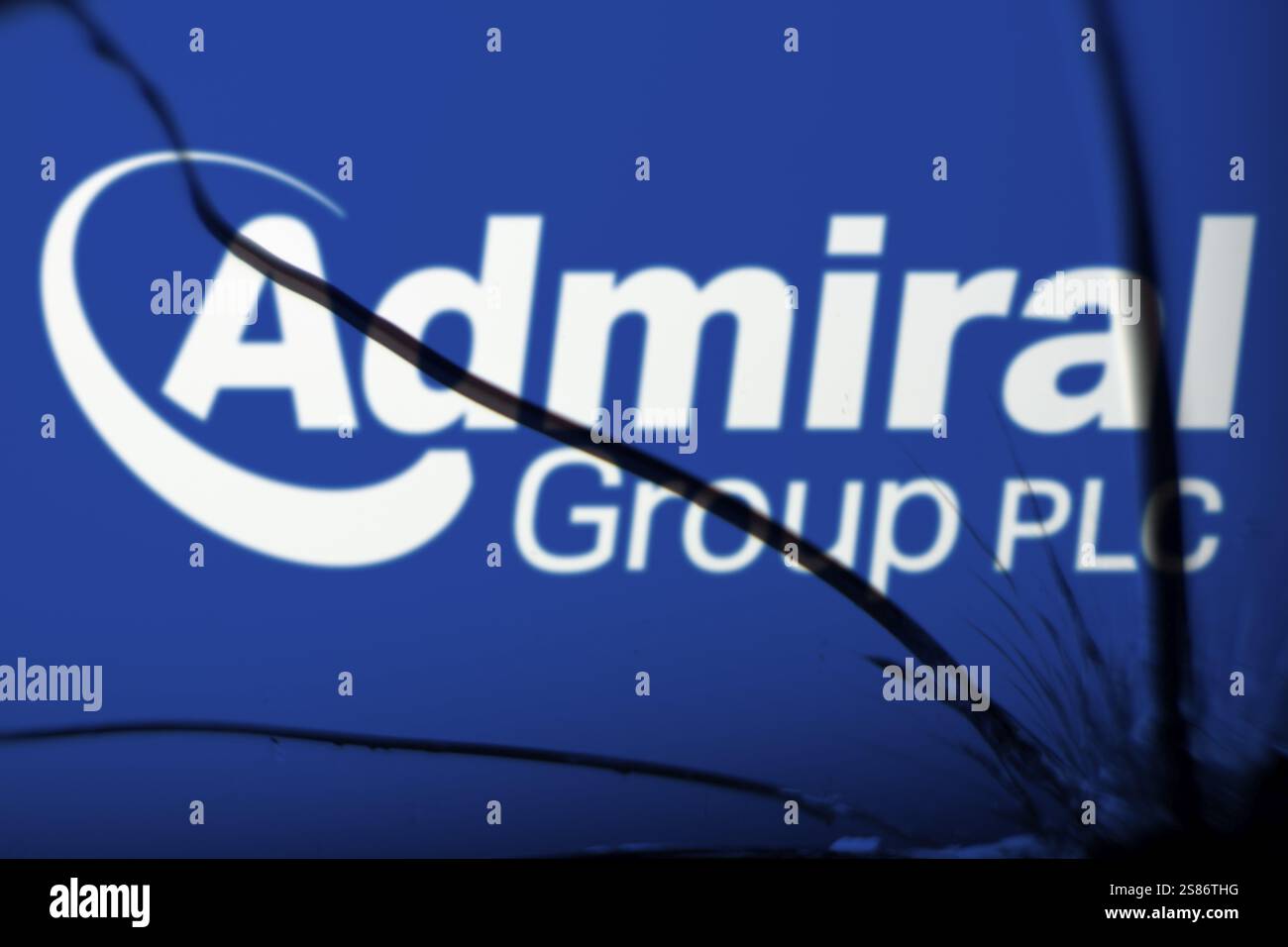 Admiral group plc logo is visible on the broken glass Stock Photo - Alamy