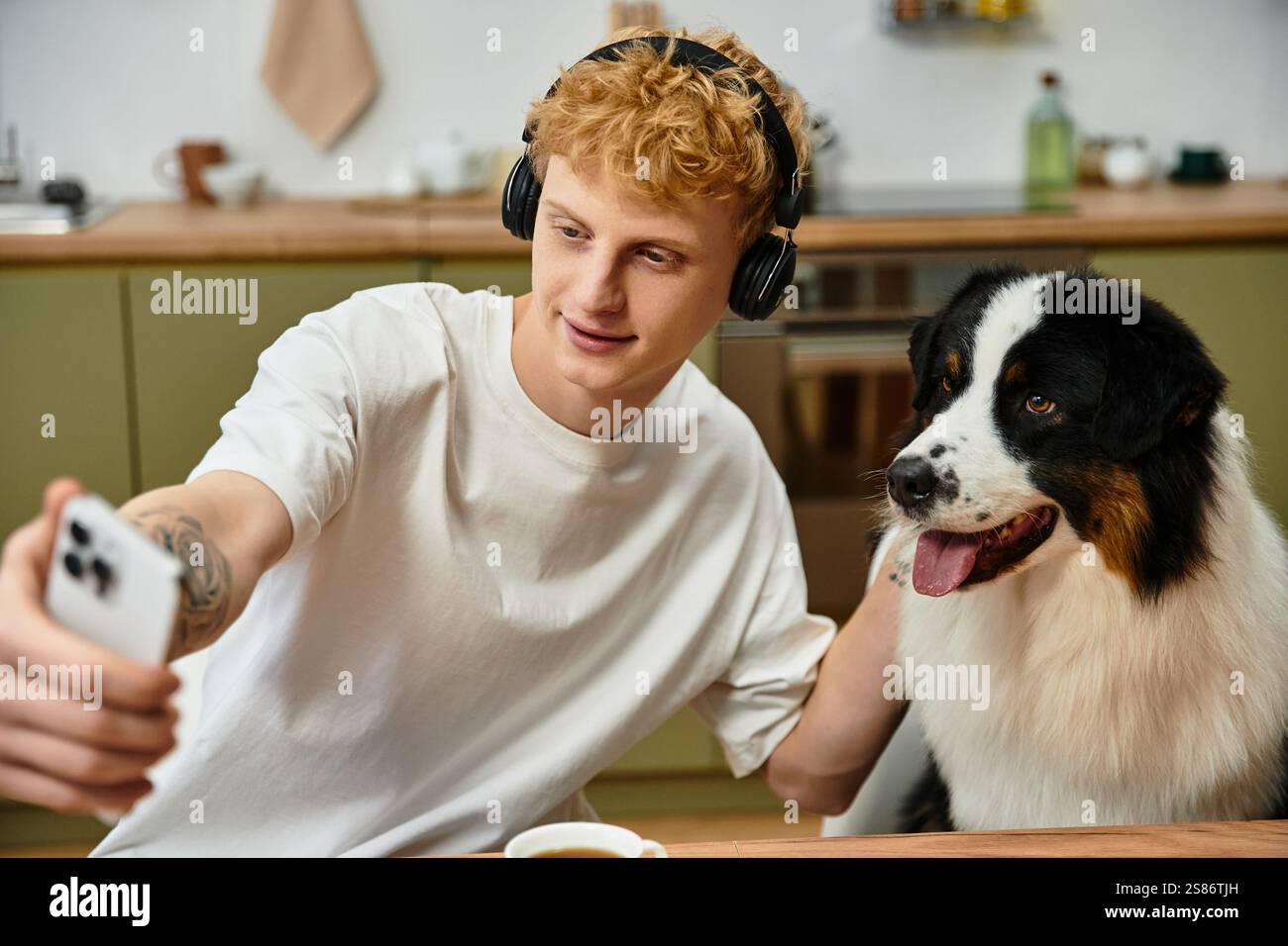 A young man with red hair is taking selfies with his Australian ...