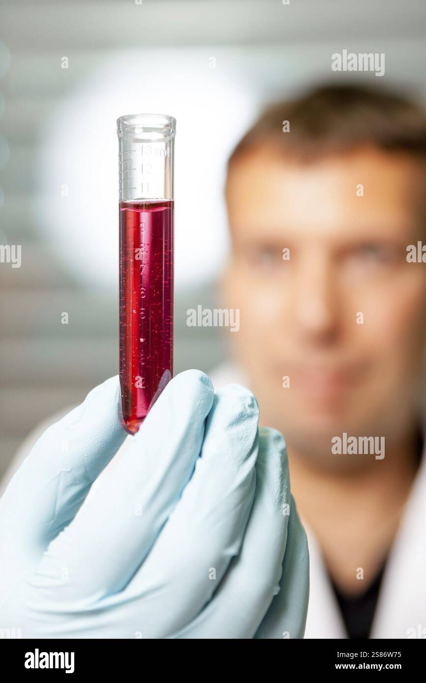 An image of test tube with a red fluid Stock Photo - Alamy