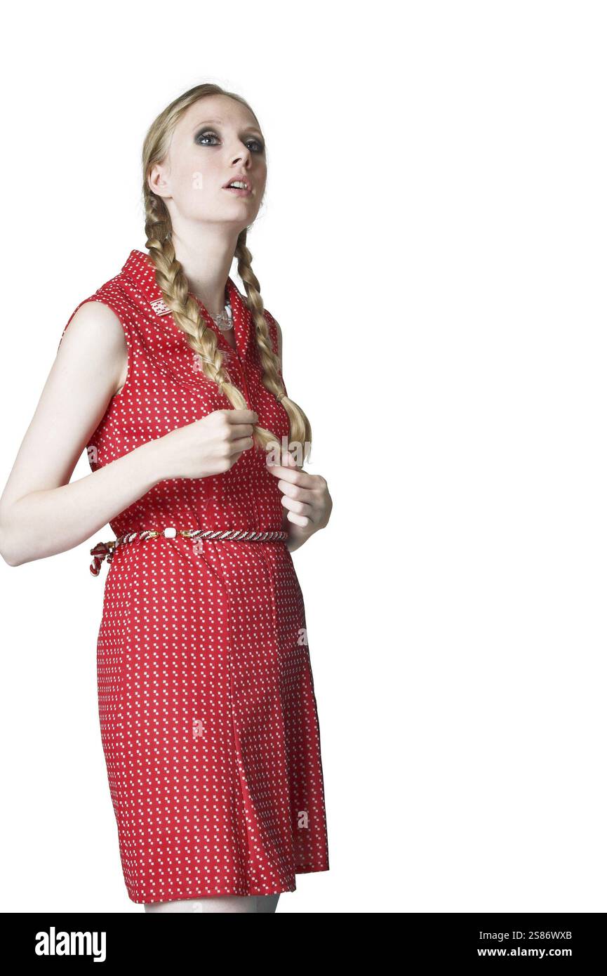 Blonde girl with plaits dressed in retro outfit isolated on white ...