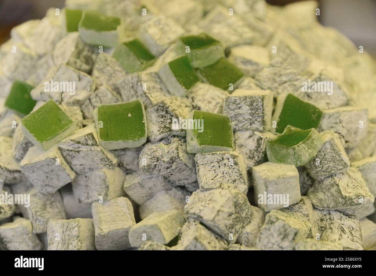 Green Lokum cubes, Turkish sweet, dusty with sugar, close-up, Istanbul ...