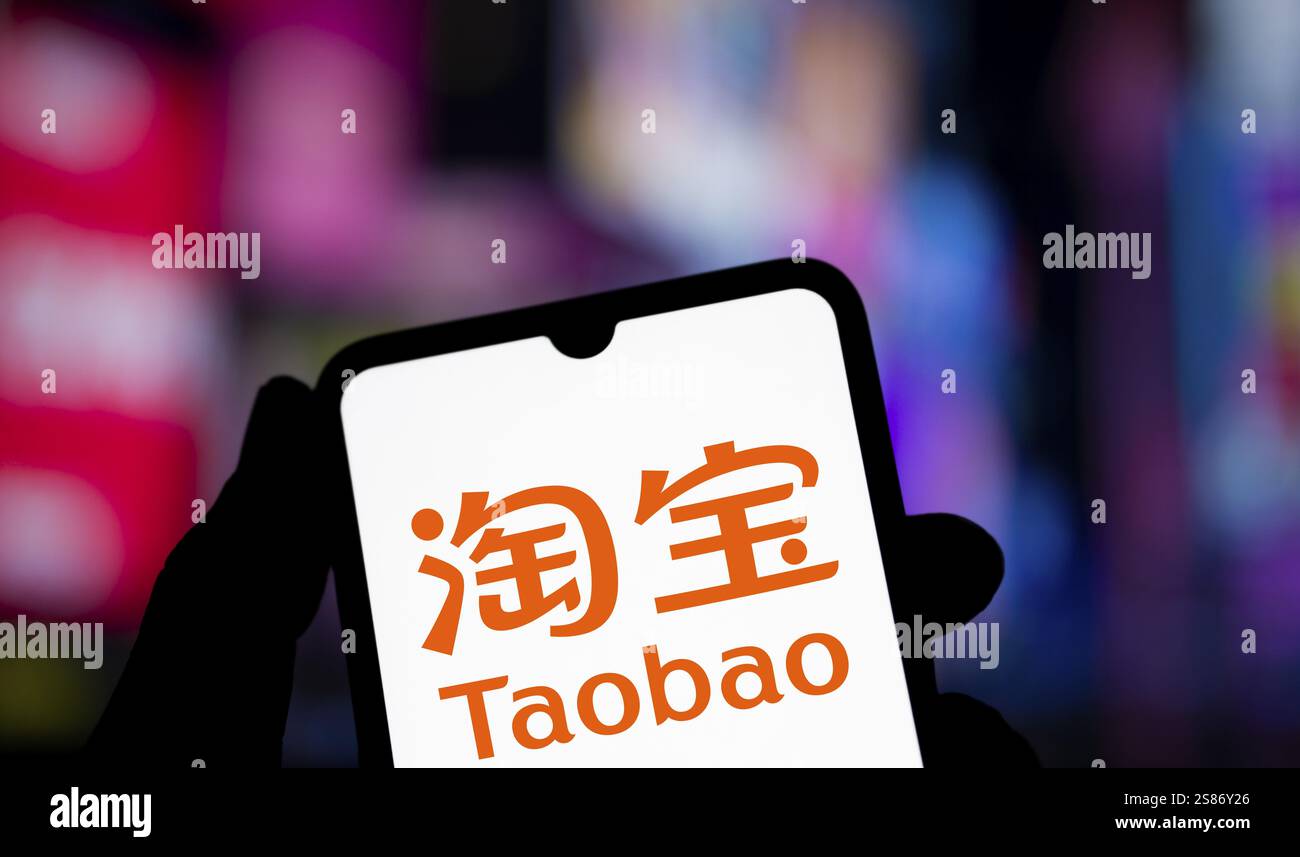 taobao logo is displayed on smartphone.Taobao is a Chinese online shopping platform Stock Photo ...