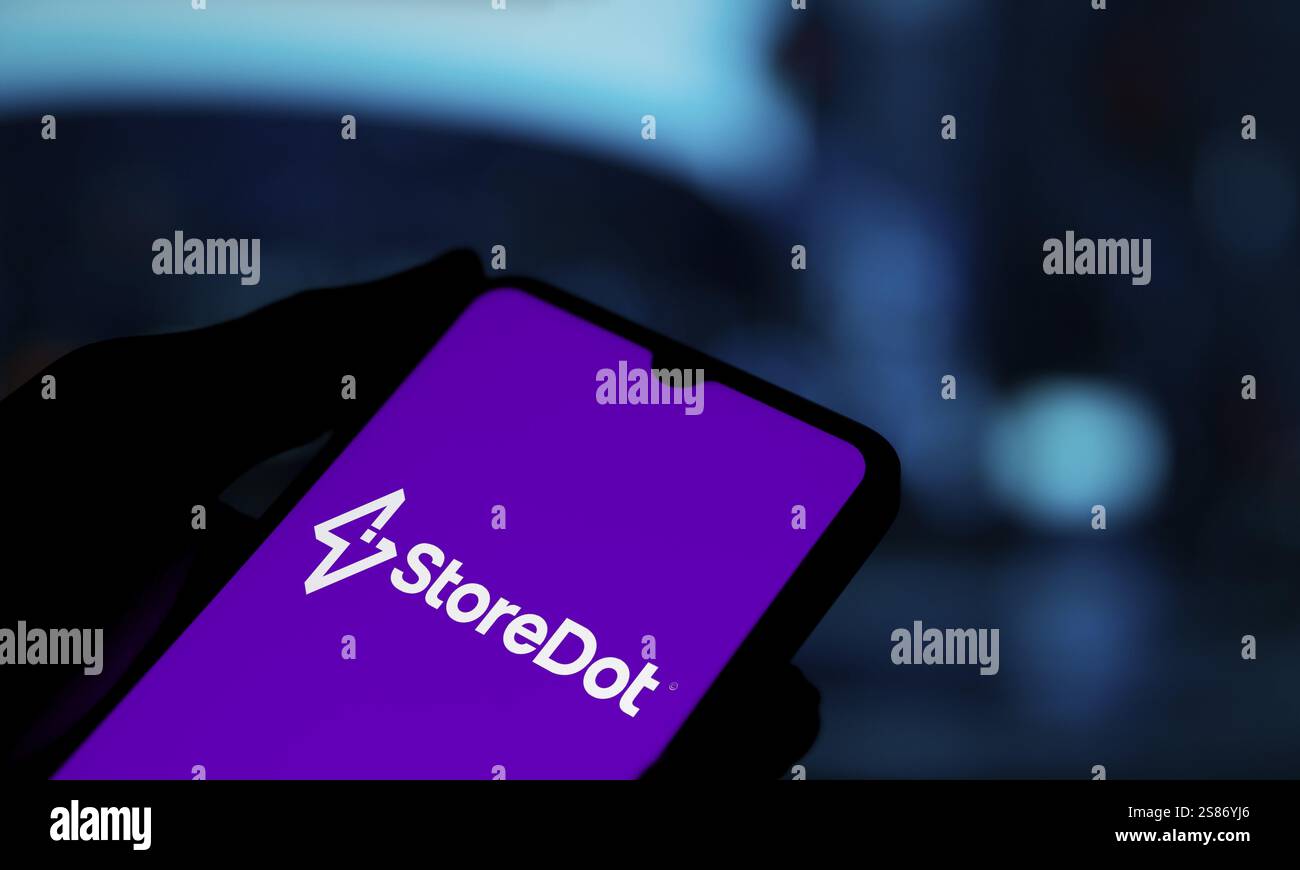 storedot logo is displayed on smartphone. StoreDot is a developer of ...
