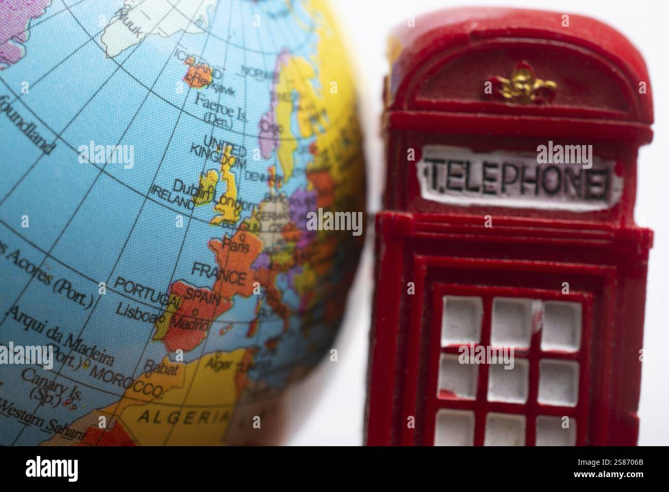 Model globe with a British telephone booth in view Stock Photo - Alamy