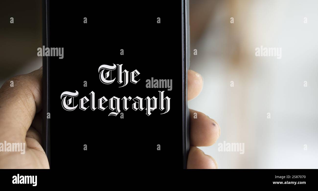 the telegraph logo is displayed on smartphone. The Telegraph is a ...