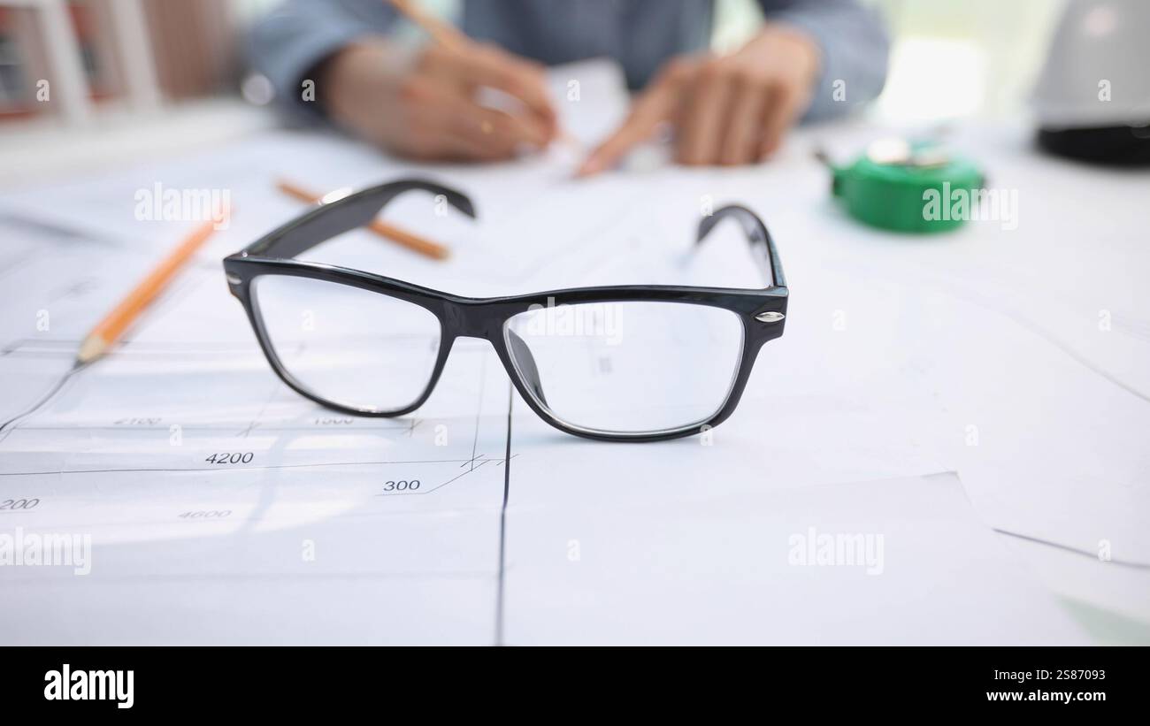 glasses on a construction drawing in the office, close-up Stock Photo ...