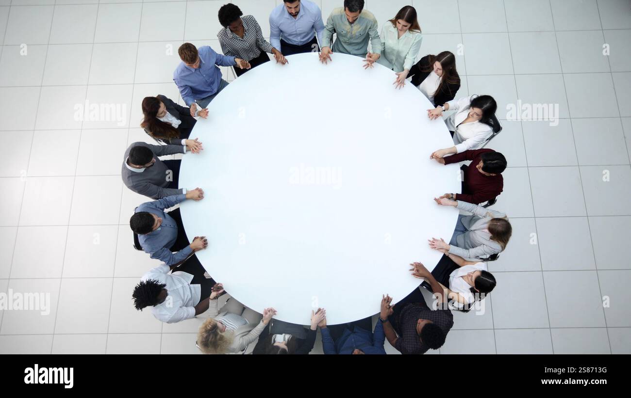Top view of group of multiethnic busy people working in office, aerial ...