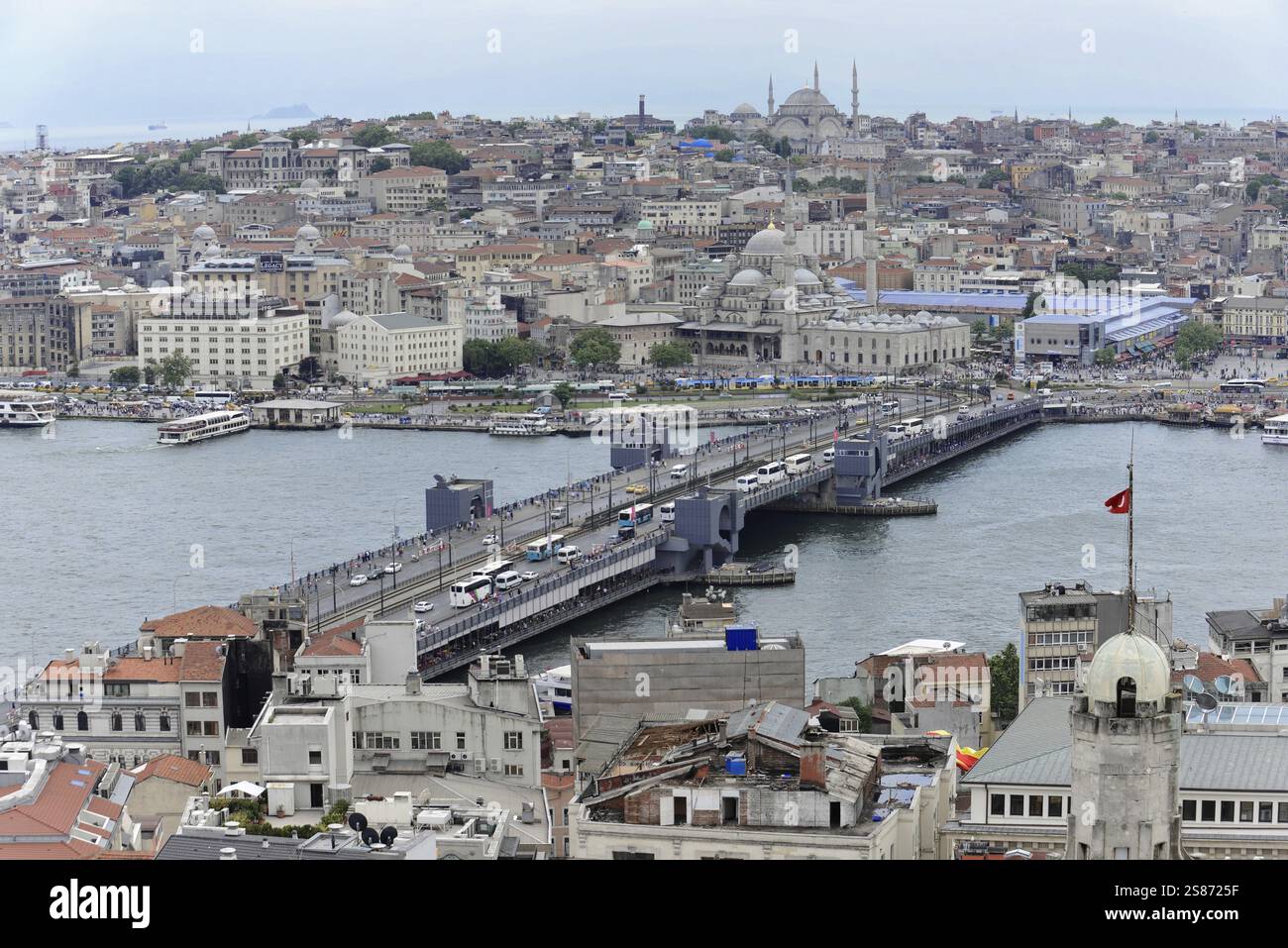 Busy bridge over a river, surrounded by an urban skyline and historic ...