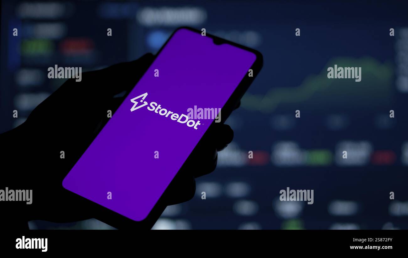 storedot logo is displayed on smartphone. StoreDot is a developer of ...