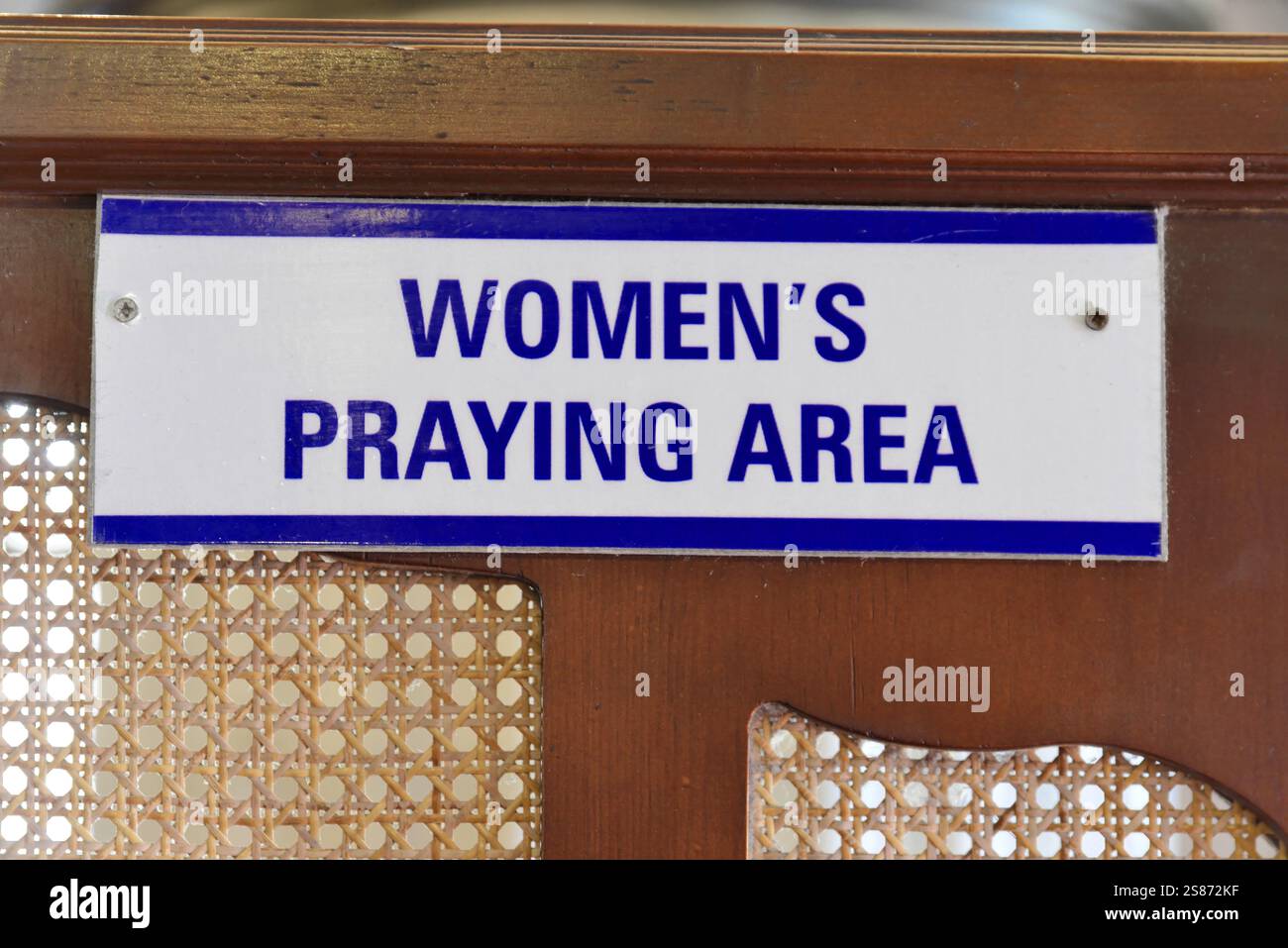 Sign with the inscription 'Womens Praying Area' indicates a demarcated ...