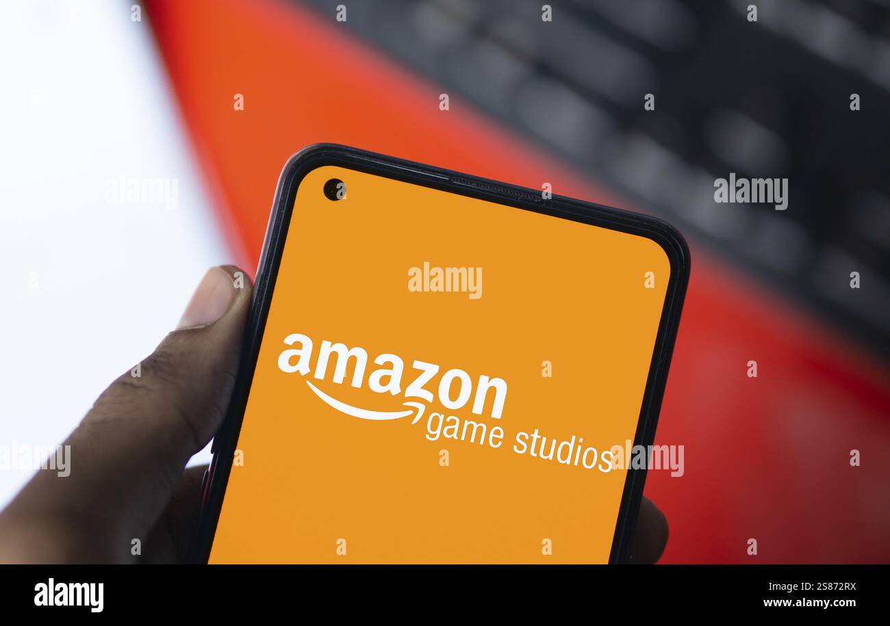 amazon game studios logo is displayed on smartphone. Amazon Games is an ...