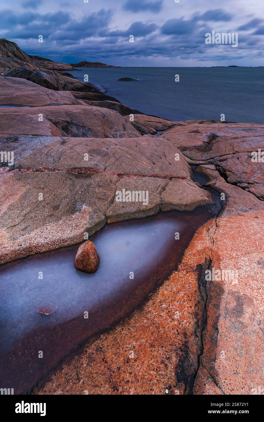 Rocky terrain outlines a calm coastal area outside Gothenburg, with a ...