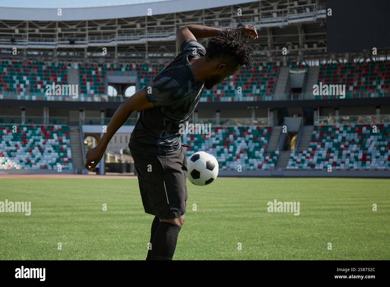 African American soccer player during match inside large stadium Stock ...