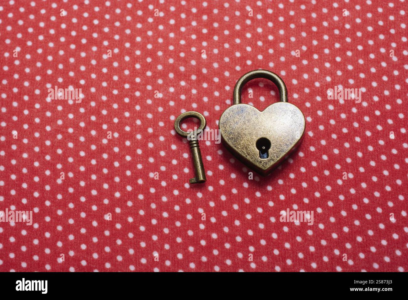 Heart shaped lock and key on an abstract background Stock Photo - Alamy