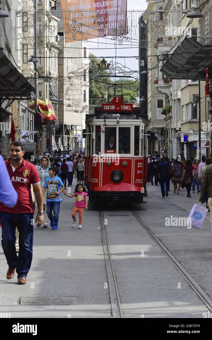 Historic tram Nostaljik Tramvay runs through shopping street Istiklal ...