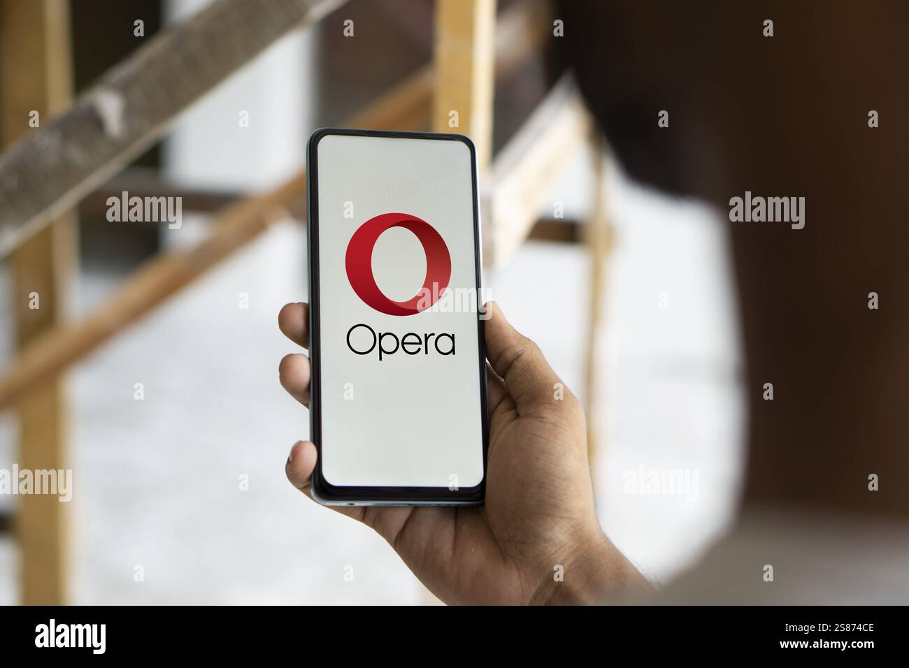 Opera logo is displayed on smartphone. Opera is a multi-platform web ...
