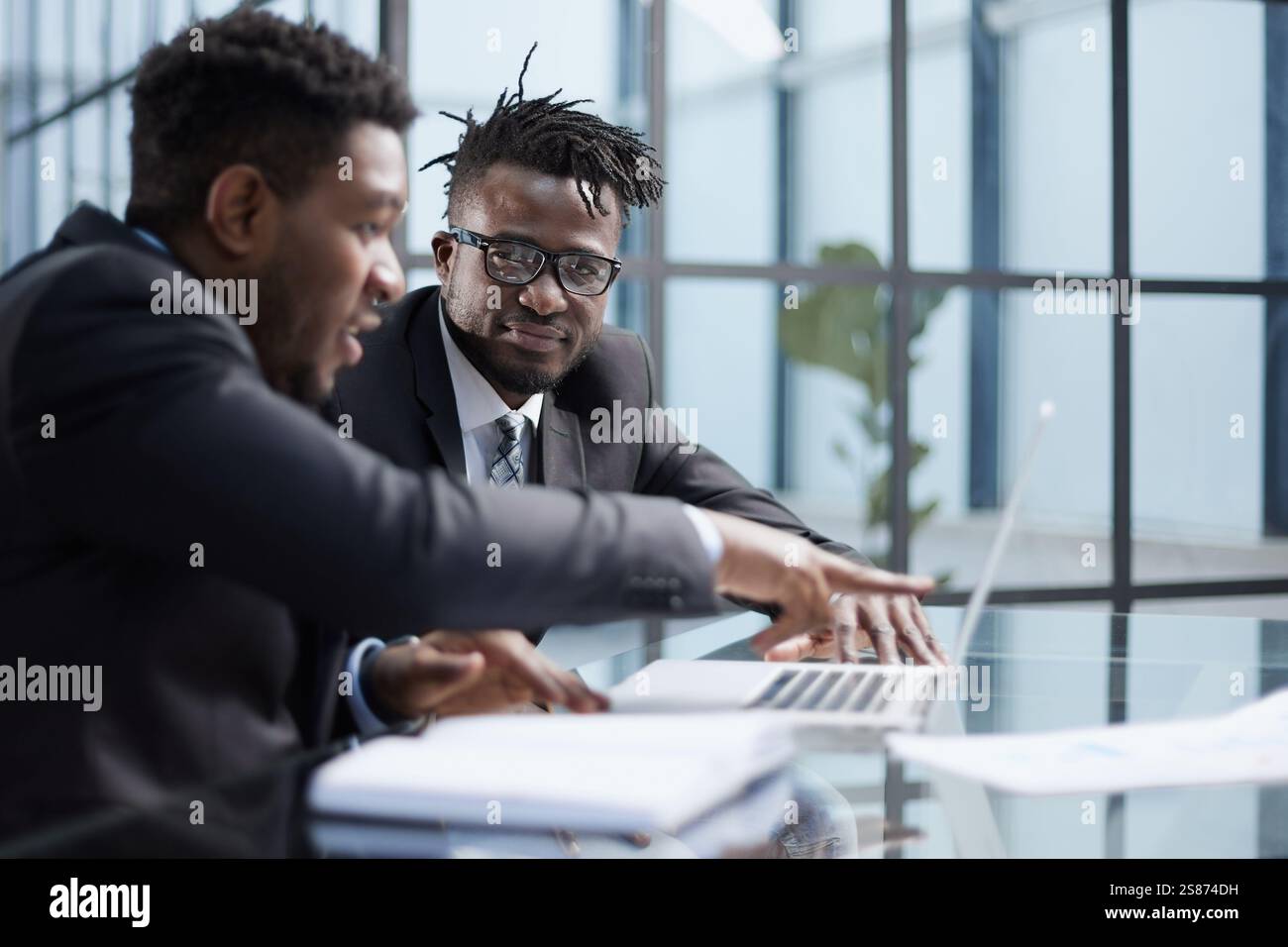 African american boss negotiating discussing contract details with ...