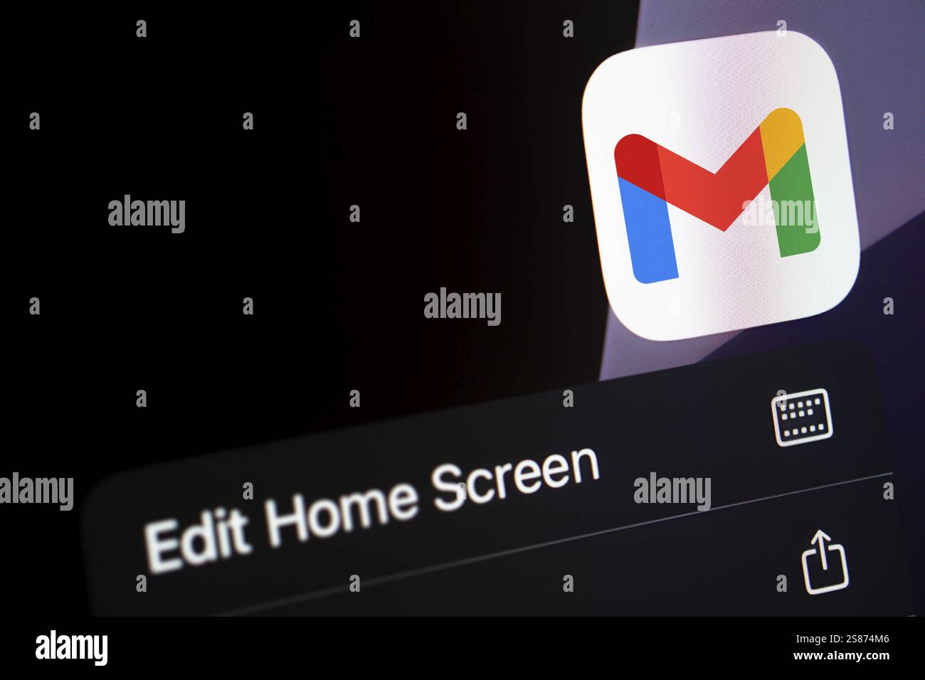 A close up of an iPhone screen displaying the Google Gmail logo Stock ...