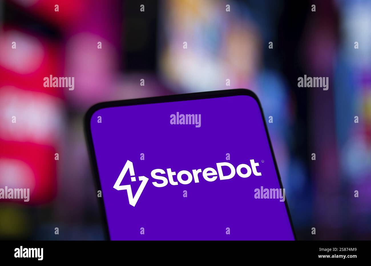 storedot logo is displayed on smartphone. StoreDot is a developer of ...
