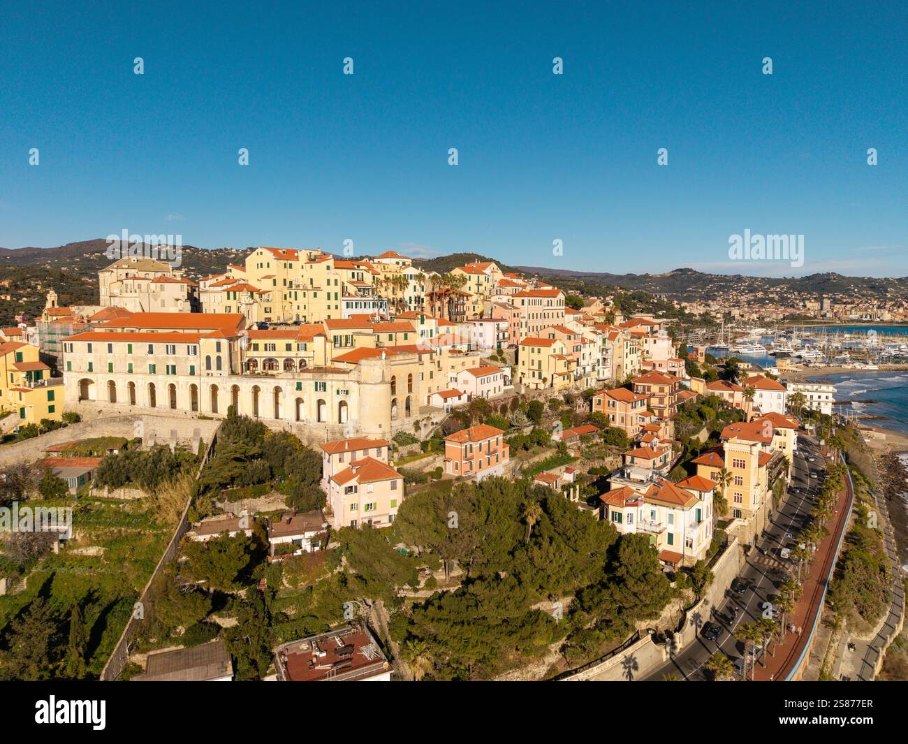Aerial view of Imperia's colorful hillside buildings and coastline ...