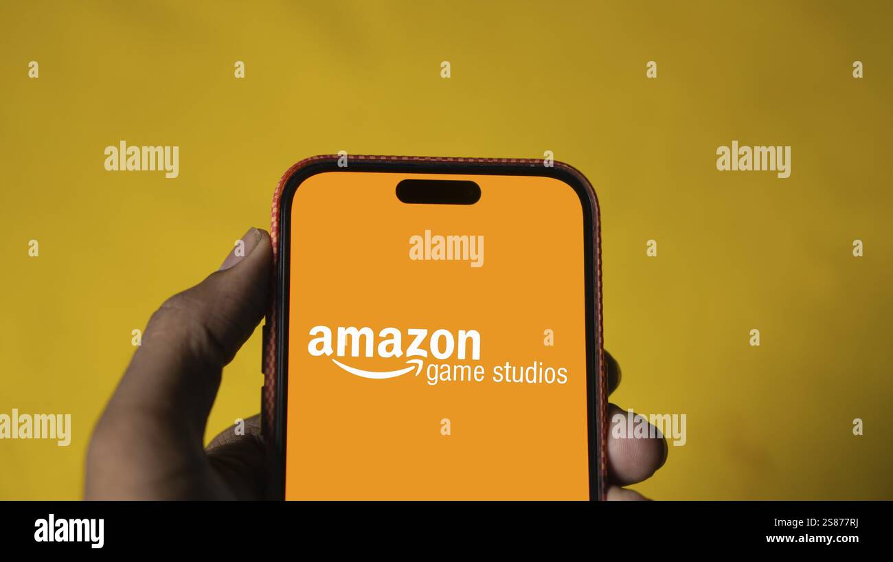 amazon game studios logo is displayed on smartphone. Amazon Games is an ...