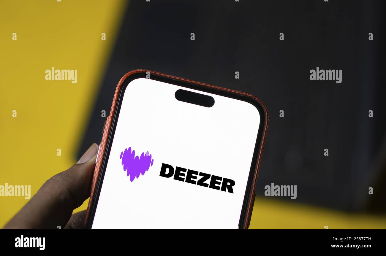 deezer logo is displayed on smartphone. Deezer is a French music ...