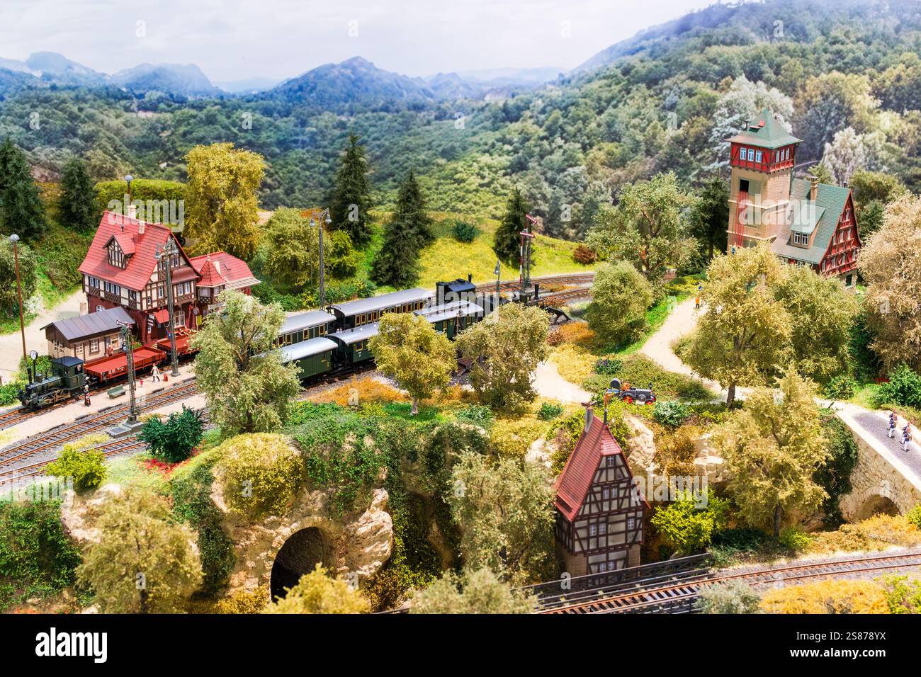 Vintage scene with steam locomotives on H0 gauge model railway layout ...