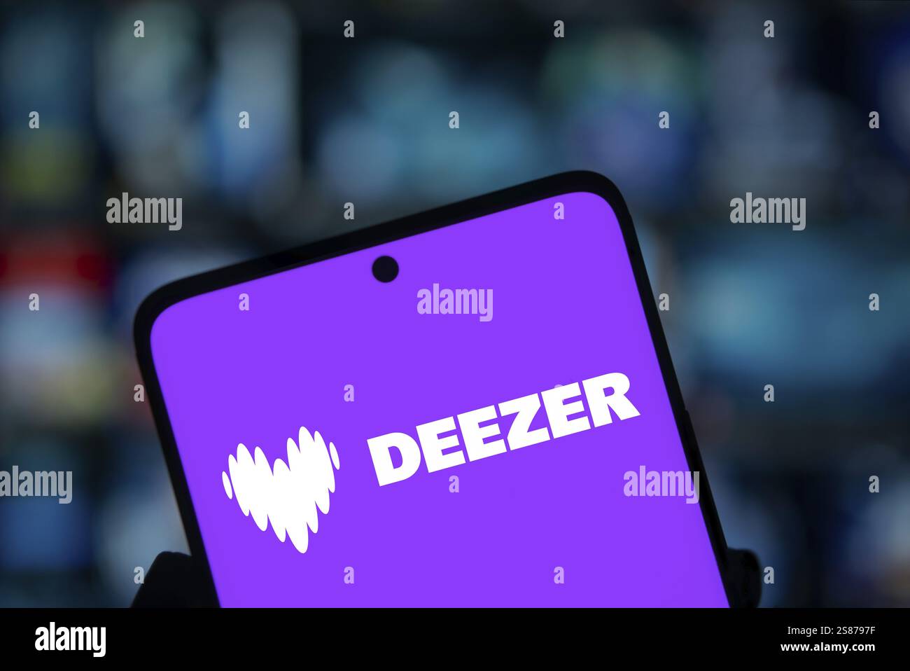 deezer logo is displayed on smartphone. Deezer is a French music ...