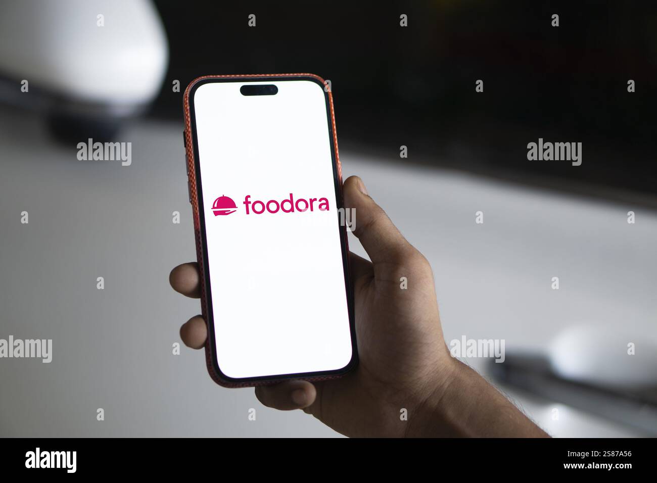 Foodora logo is displayed on smartphone. Foodora is an online food ...