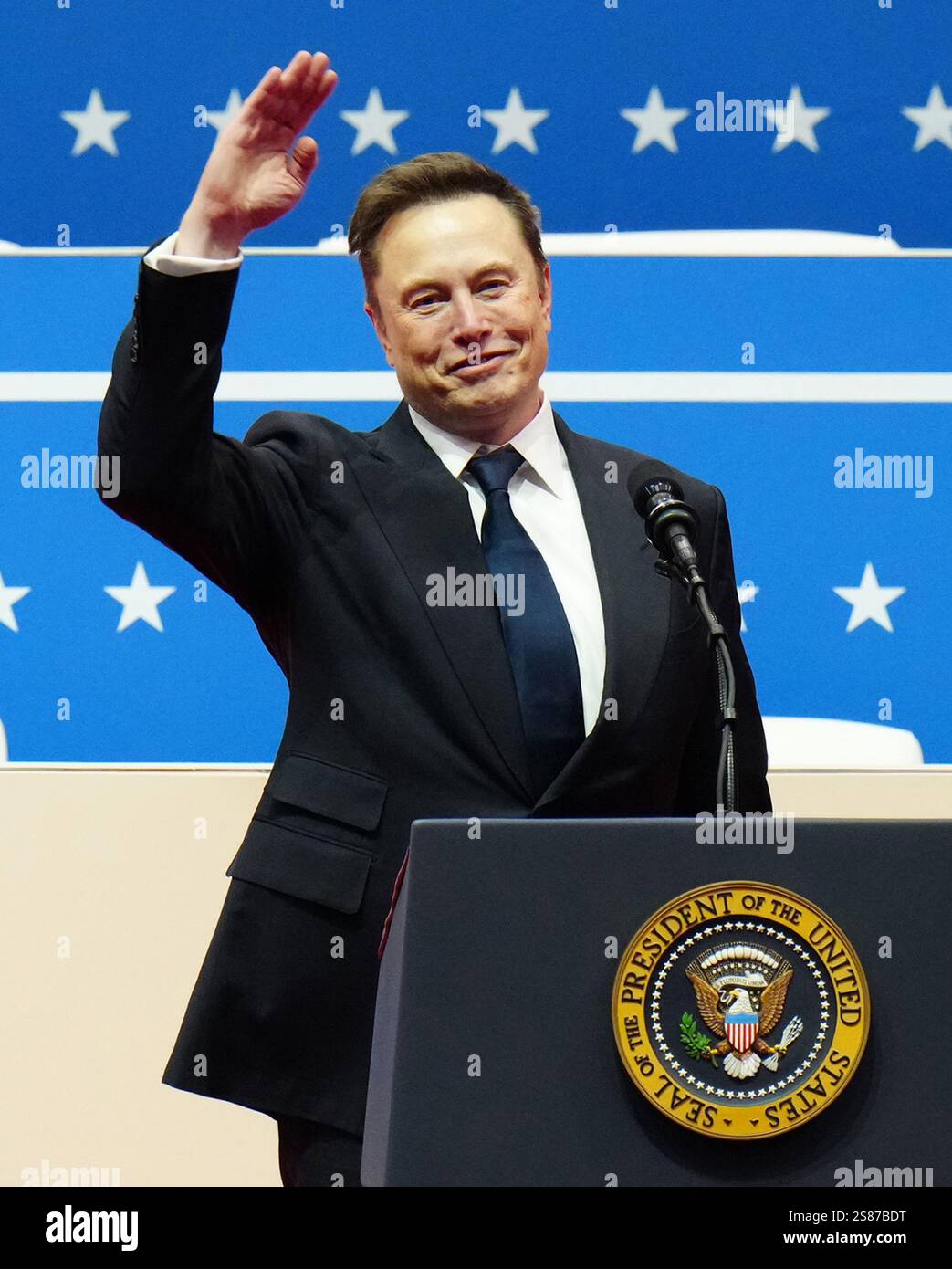 Tesla CEO and X owner Elon Musk gestures on stage when he speaks inside ...