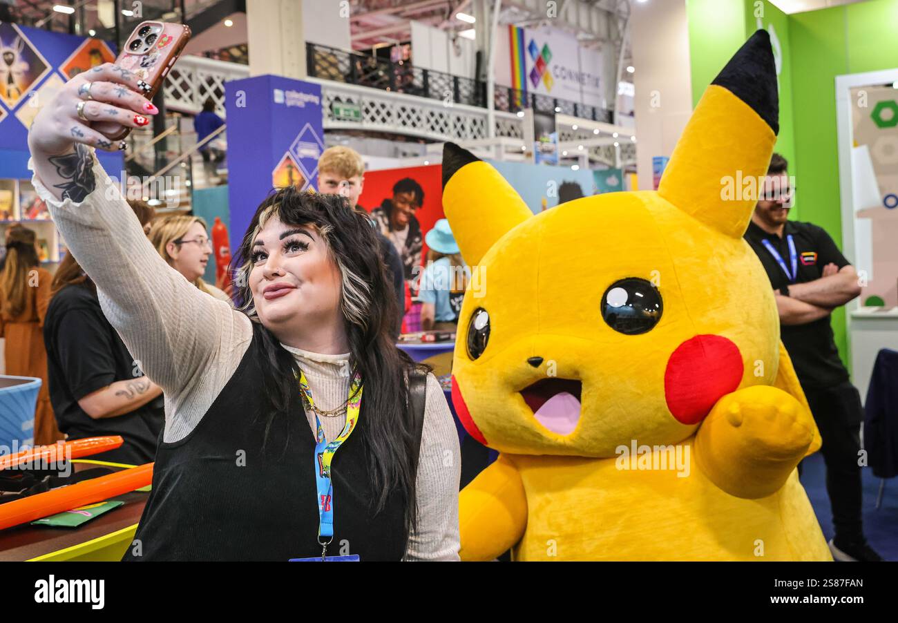 London, UK, 21st Jan 2025. A media visitor takes selfies with a Pikachu ...