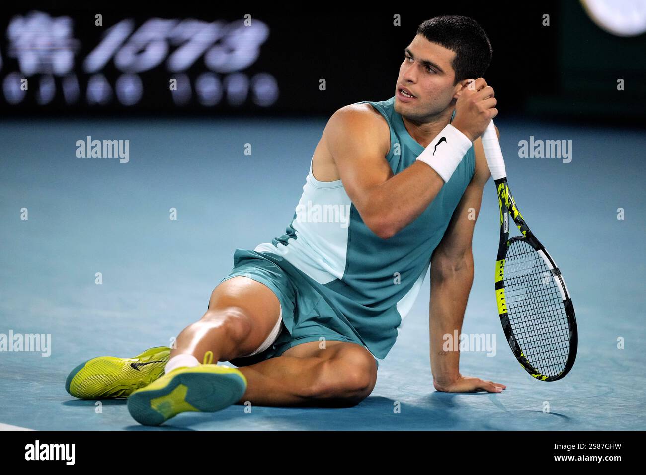 Carlos Alcaraz of Spain reacts following a fall during his quarterfinal ...