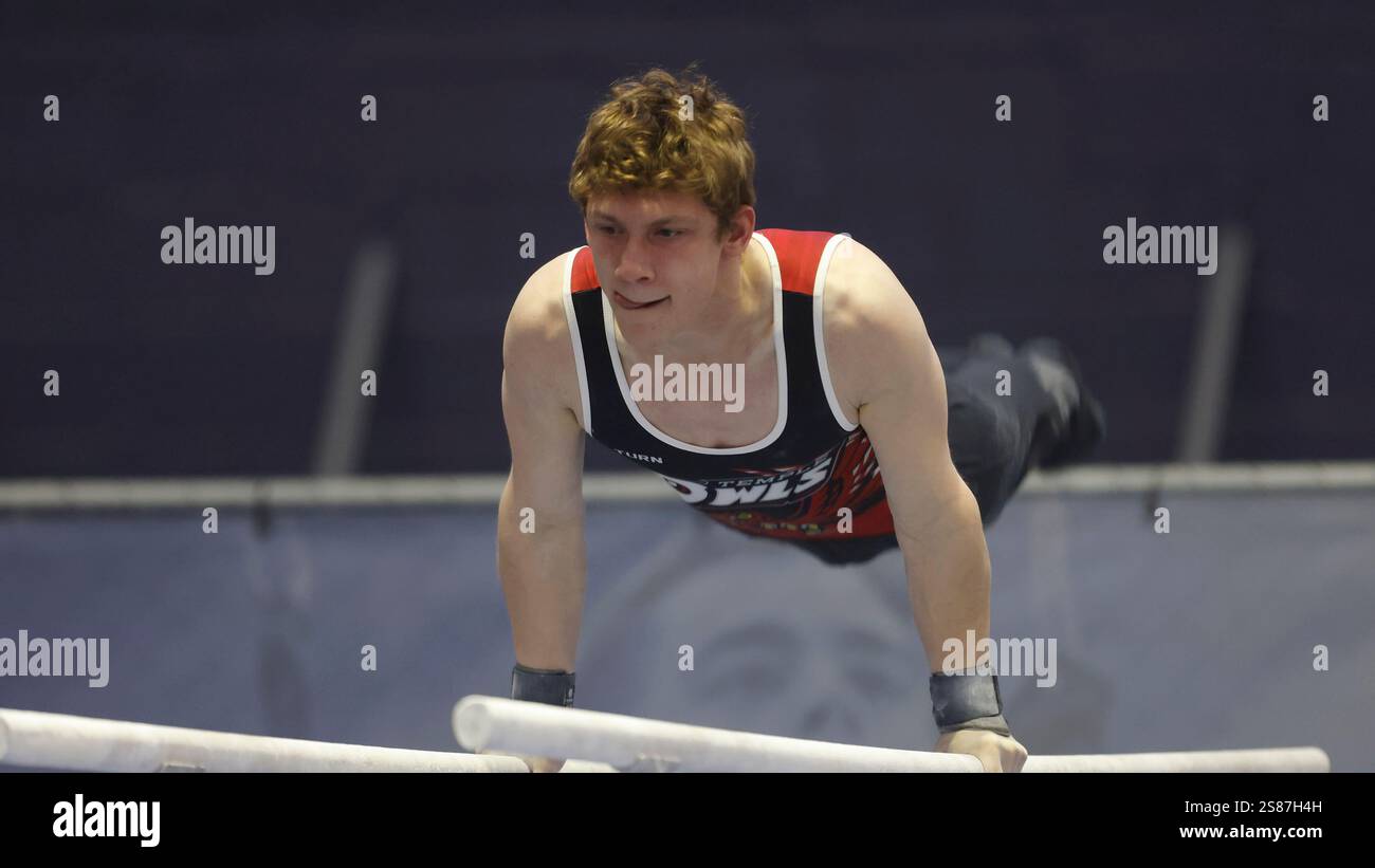 Temple gymnast Max Pazera competes on the parallel bars during an NCAA ...