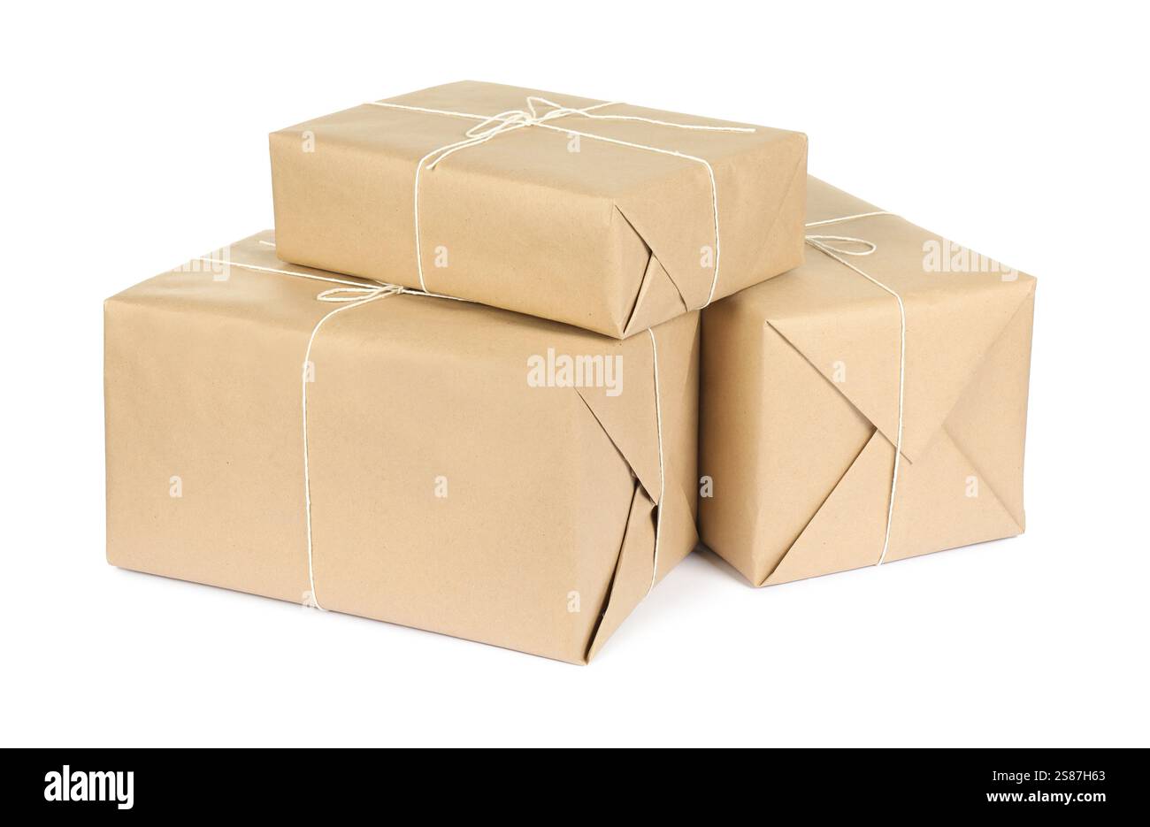 Parcel boxes wrapped in paper isolated on white Stock Photo - Alamy