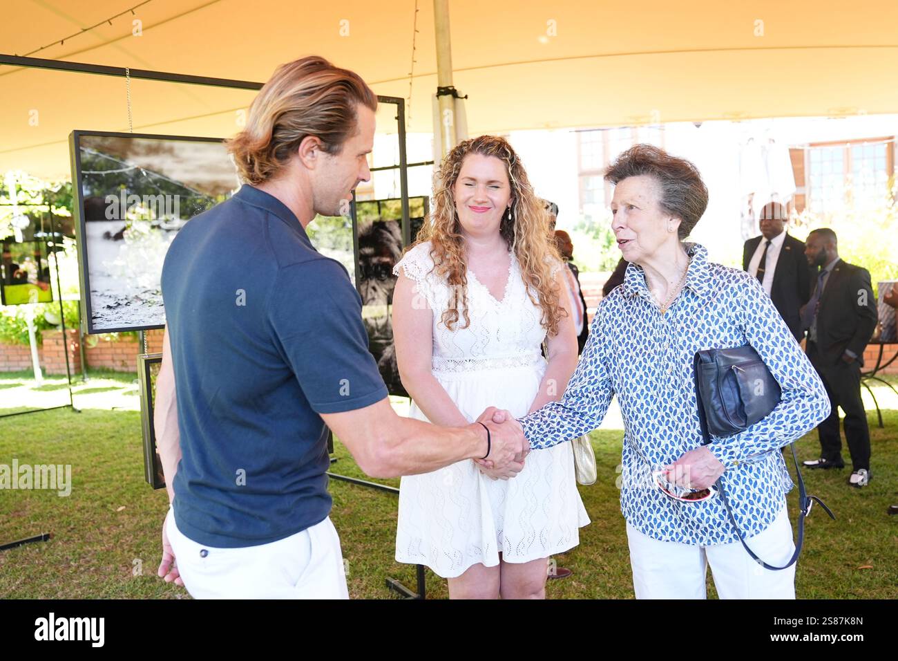 The Princess Royal views an exhibition by former England cricketer Nick Compton (left), grandson ...